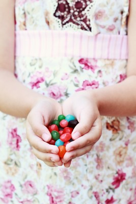 Girl giving candy – Beth Bingaman